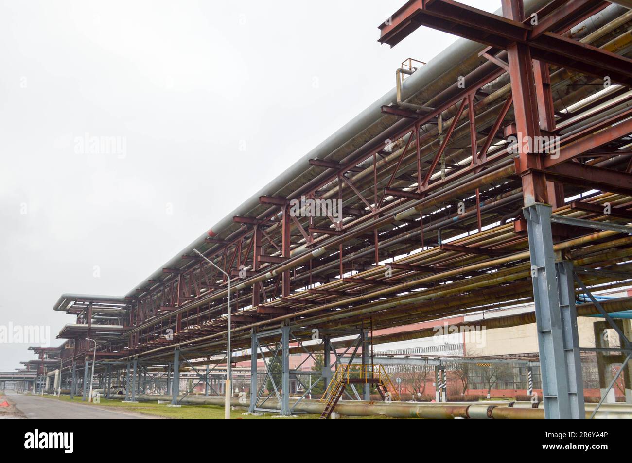 Industrial trestle for pipes. Iron pipes in the oil refinery ...