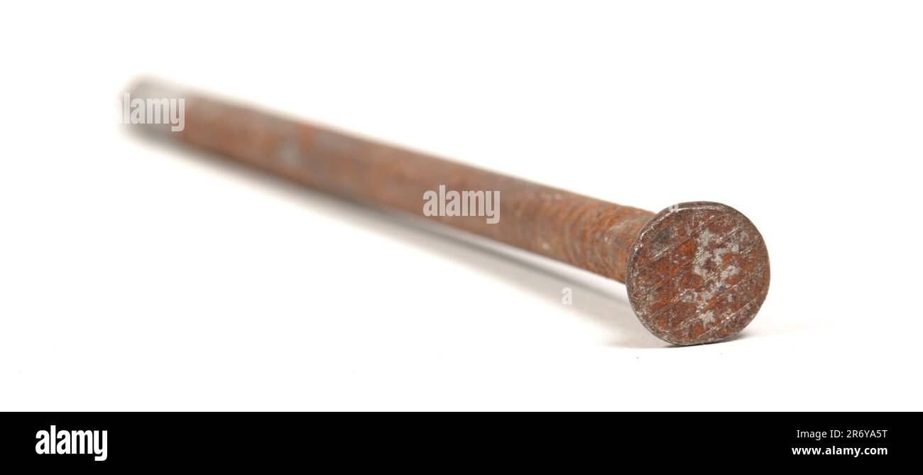 Macro view of rusty nail over a white background Stock Photo - Alamy