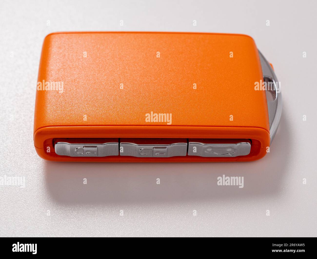 Modern wireless orange car ignition key on a white background. Wireless ...