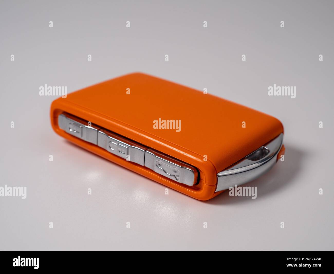 Modern wireless orange car ignition key on a white background. Wireless ...