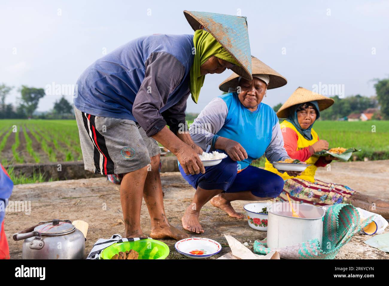 Rice farmers having a breakfast during a planting season in Karanganyar ...