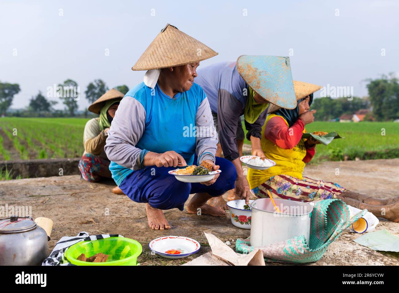 Rice farmers having a breakfast during a planting season in Karanganyar ...