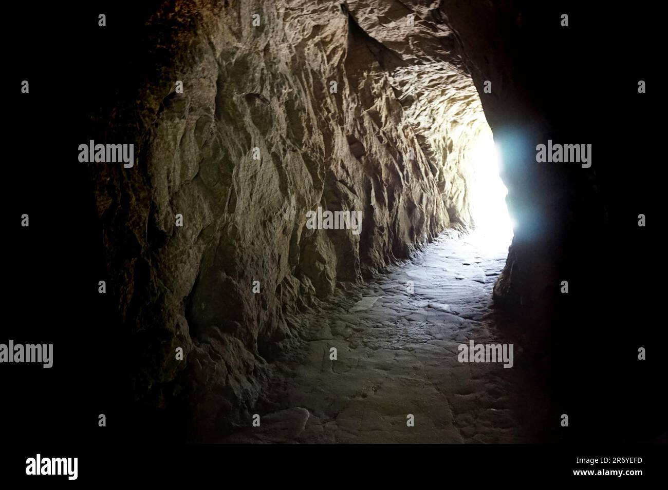 cave entry from the dark as nice background Stock Photo - Alamy
