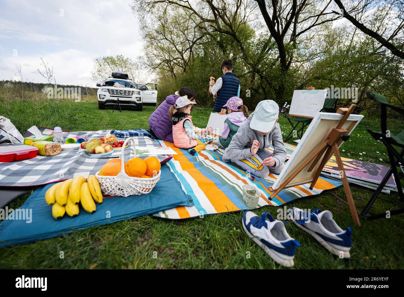 Happy young family, mother and children having fun and enjoying outdoor ...