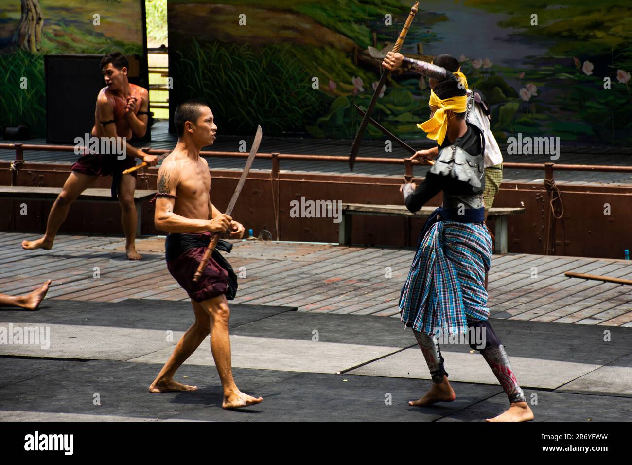 Actress women and actor men acting present traditional thai war history on antique local theater ...