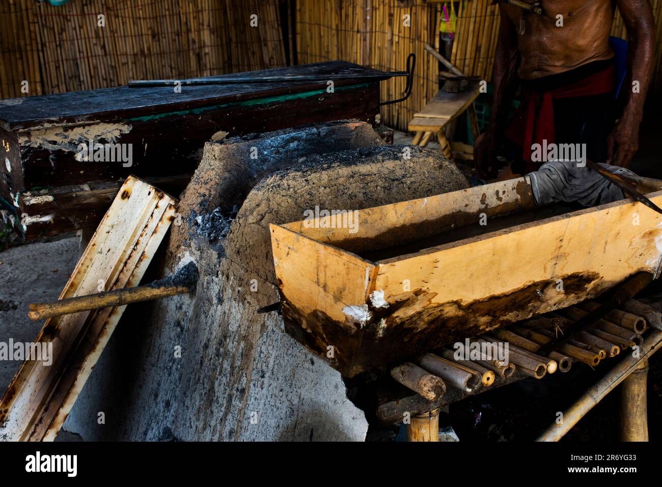 Thai blacksmith or metalsmith use stove sword forge making ancient iron ...