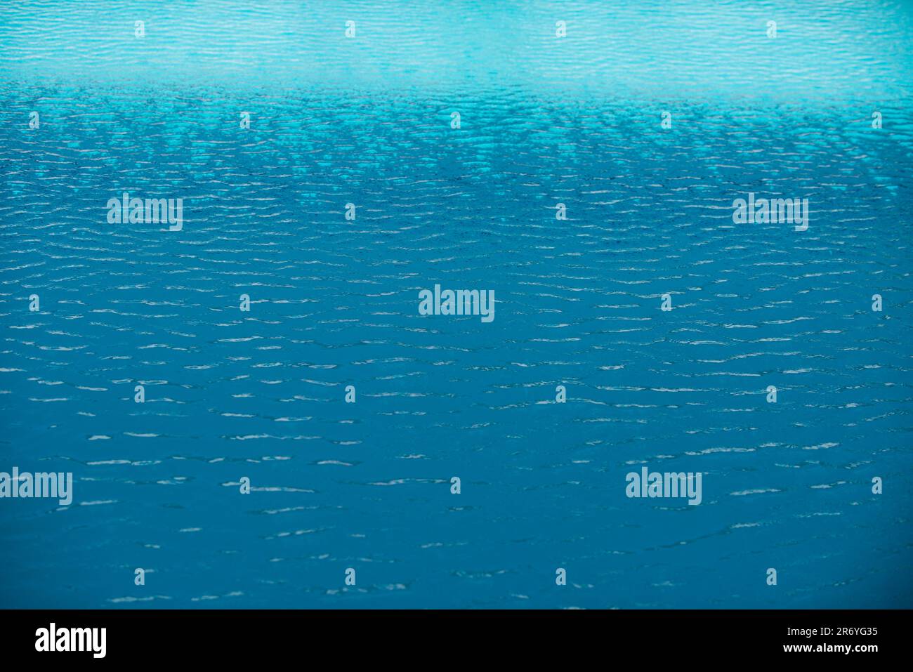 Water background. Blue water, ripples and highlights. Texture of water ...