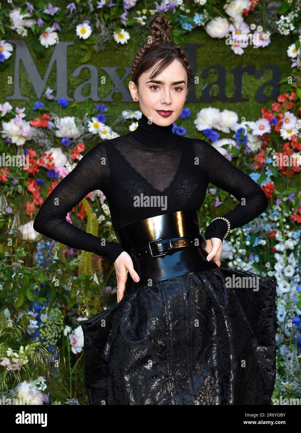 Lily Collins arrives at Max Mara's fashion show at Stockholm City Hall ...