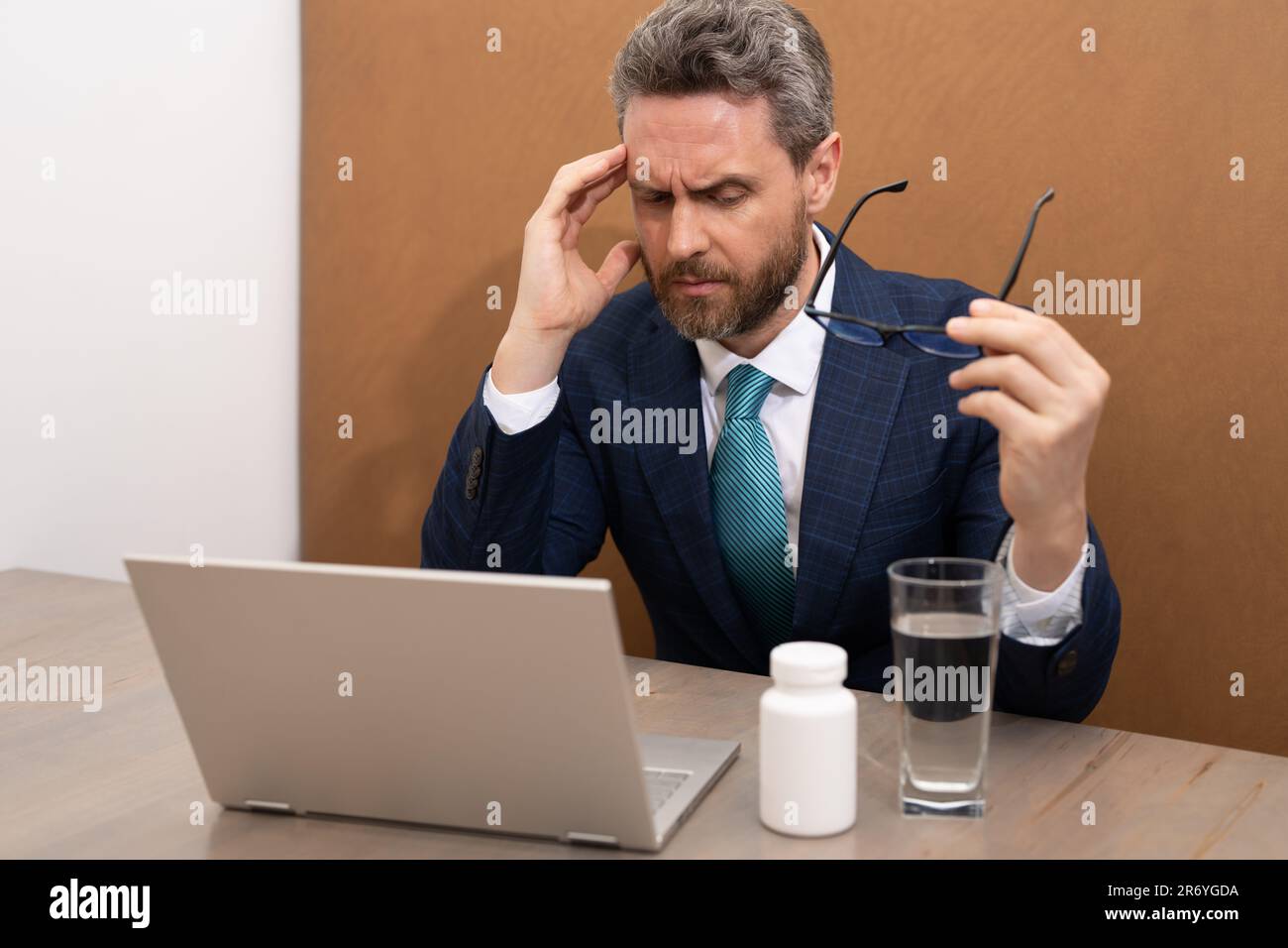 Business man feel pain holding glasses rubbing dry irritated eyes ...