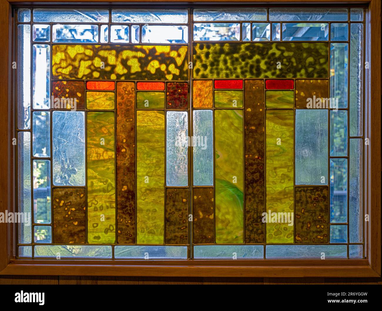 Stained glass window with two sliding panels in a wood frame Stock ...