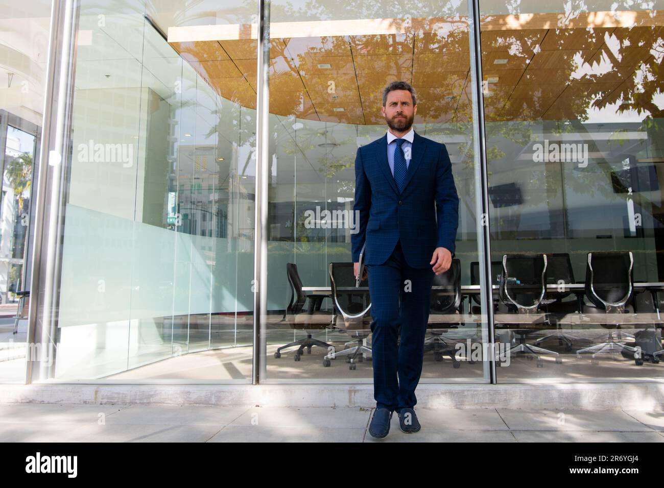 Executive businessman walking. Portrait of ceo near modern office in ...