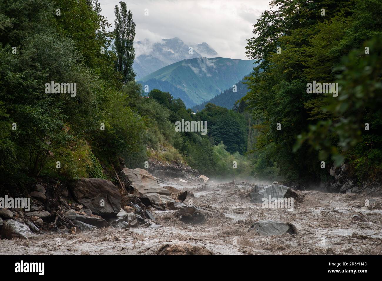 Flooded river in the mountain valley Stock Photo - Alamy