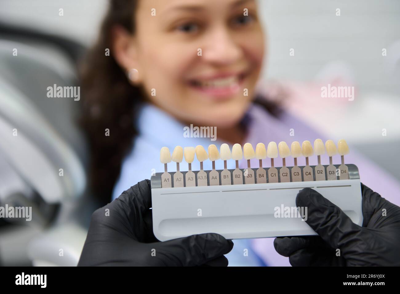 Selective focus on tooth color chart in the hands of a dentist ...