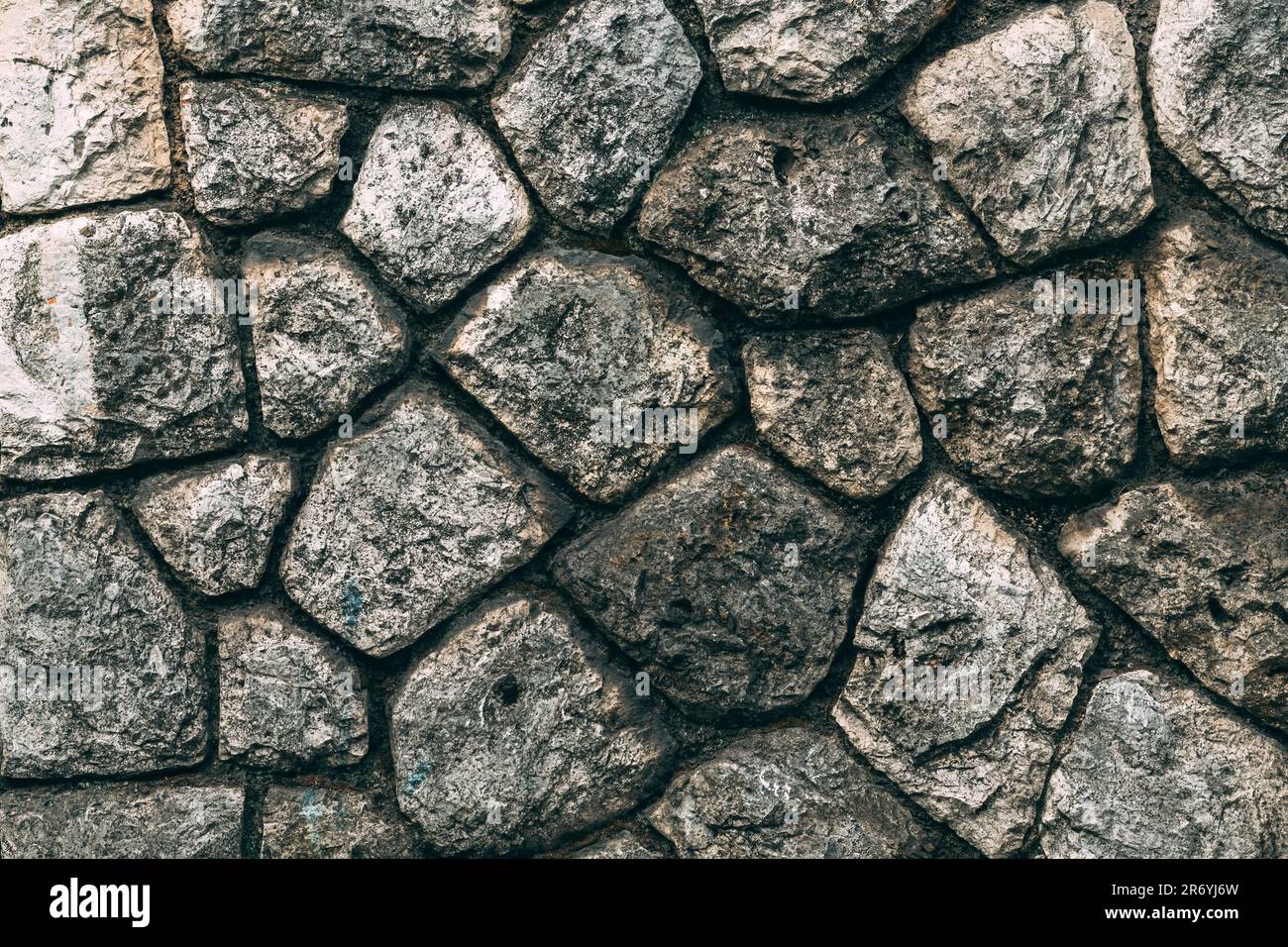 Old stone wall facade pattern as background. Detail from the town of ...