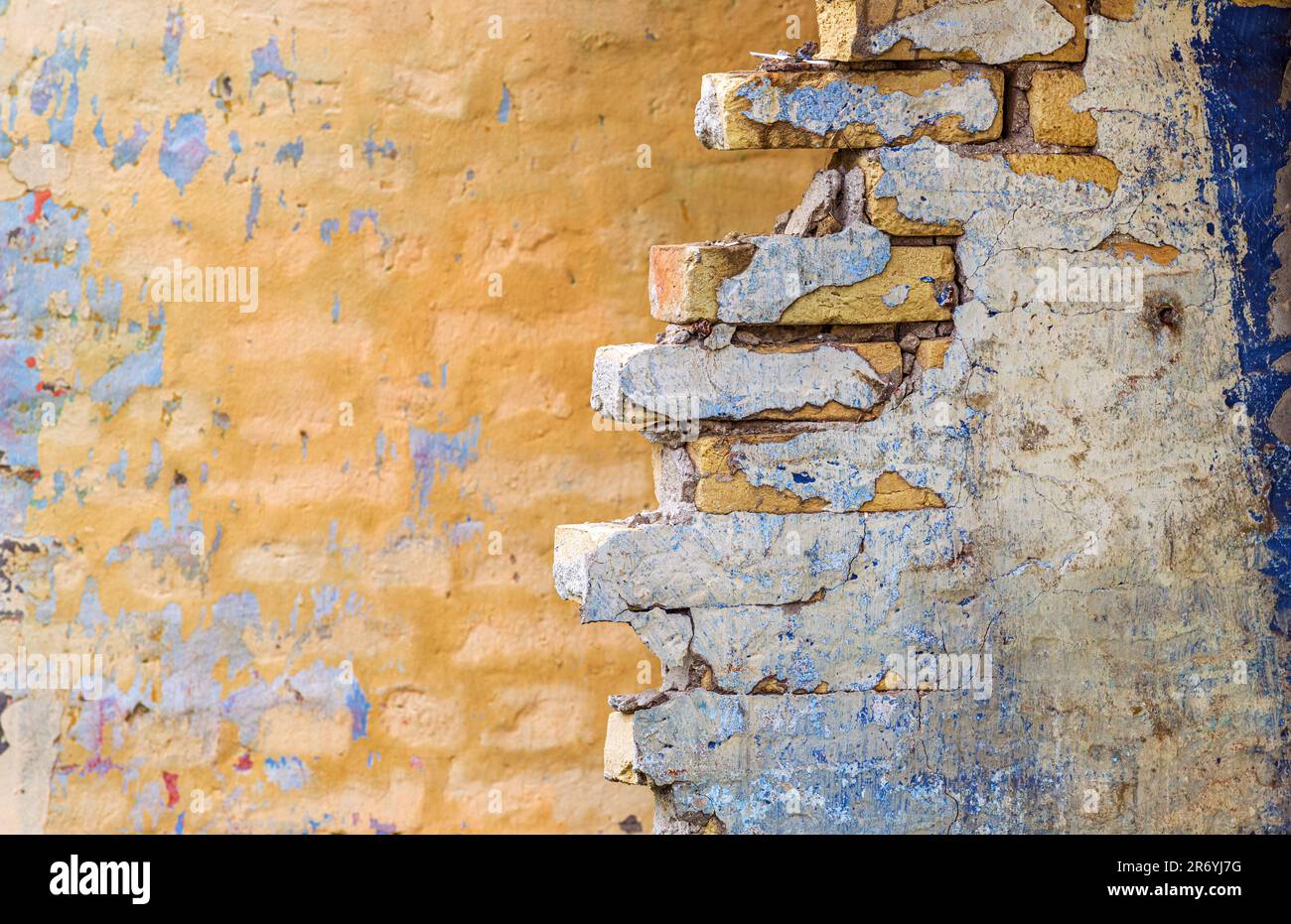 Rundown old brick wall of and ruined house as background, selective ...