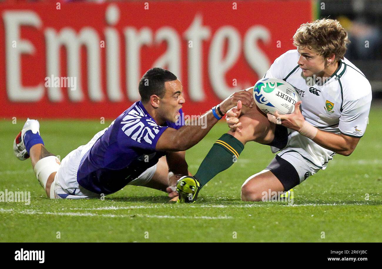 Samoa’s George Stowers tackles South Africa’s Pat Lambie during a Pool ...