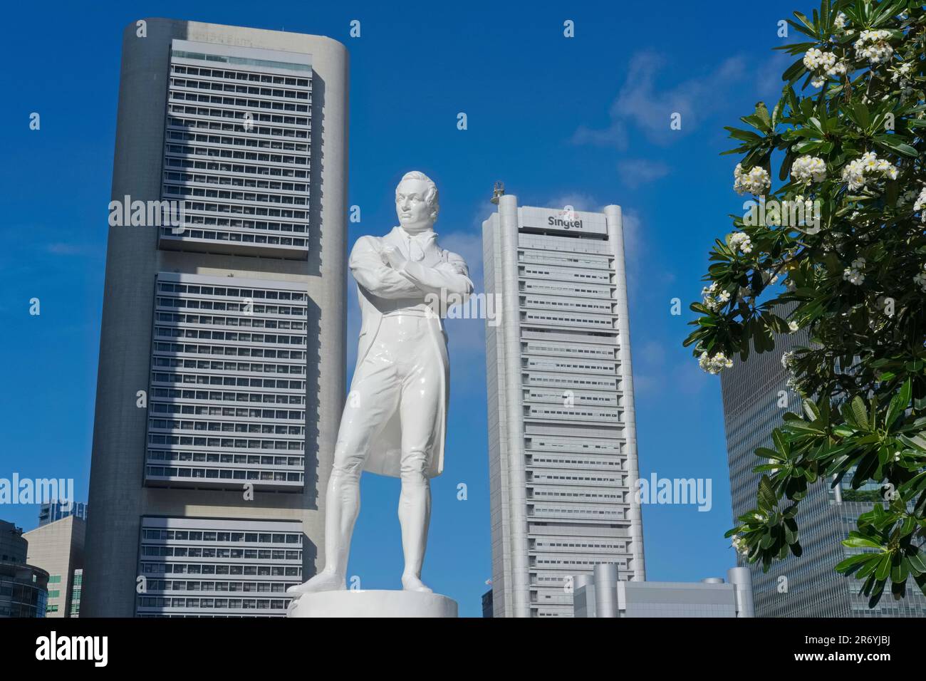 Statue of Sir Stamford Raffles at Raffles' Landing Site by the Singapore River, high rise ...