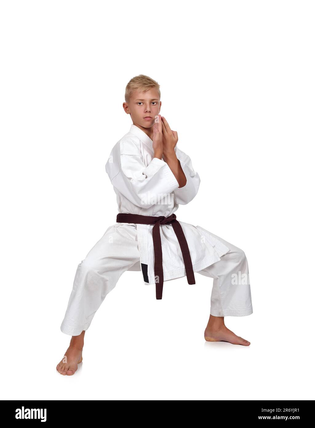 karate boy fighting position in white kimono Stock Photo - Alamy