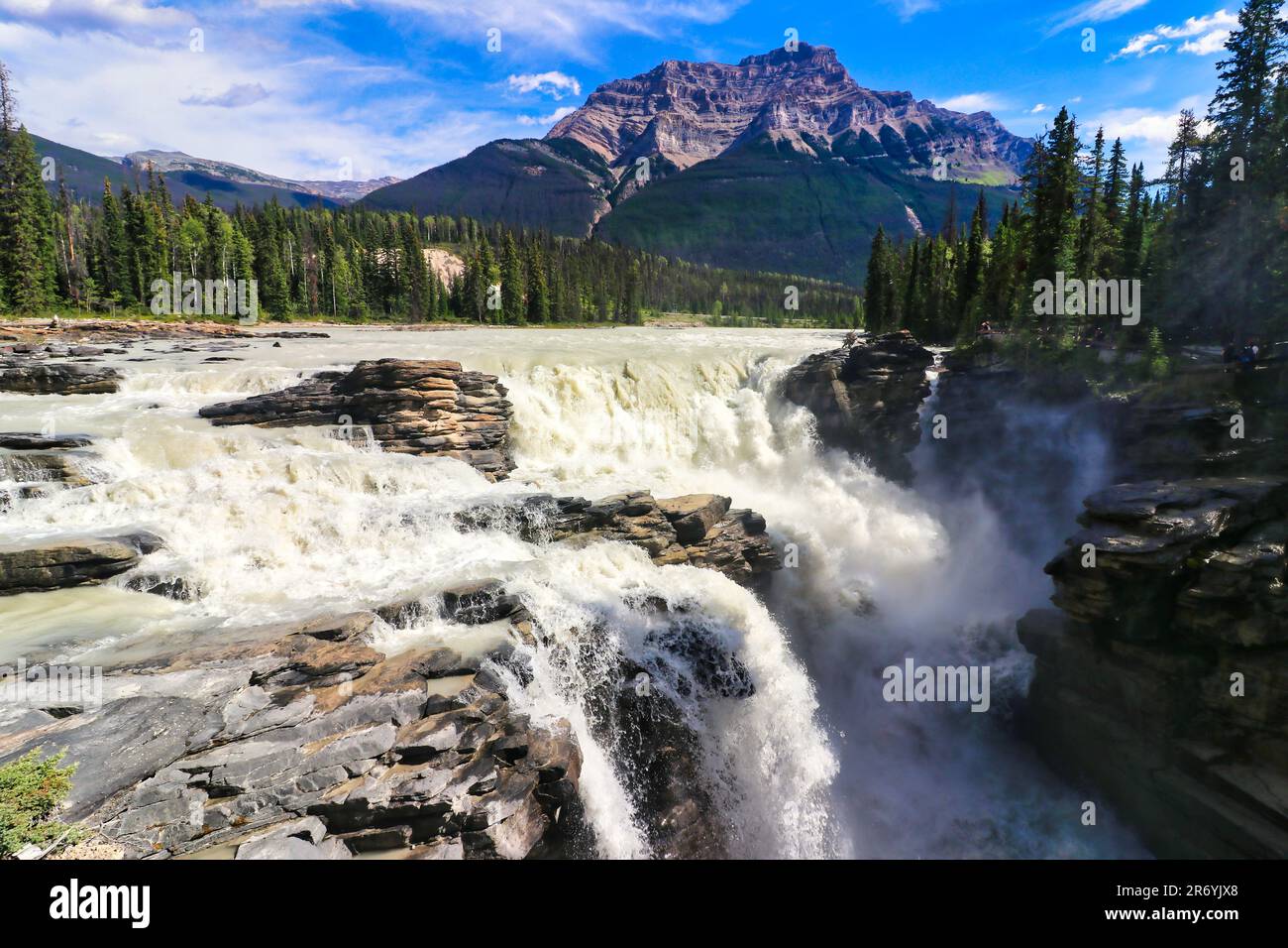 Mount Edith Cavell at 3363 meters towers above the churning waters of ...
