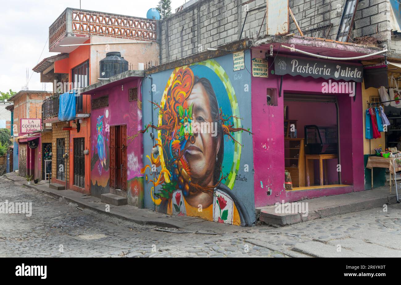 Mural painted on wall pf pasteleria shop on corner of street Tepoztlán ...