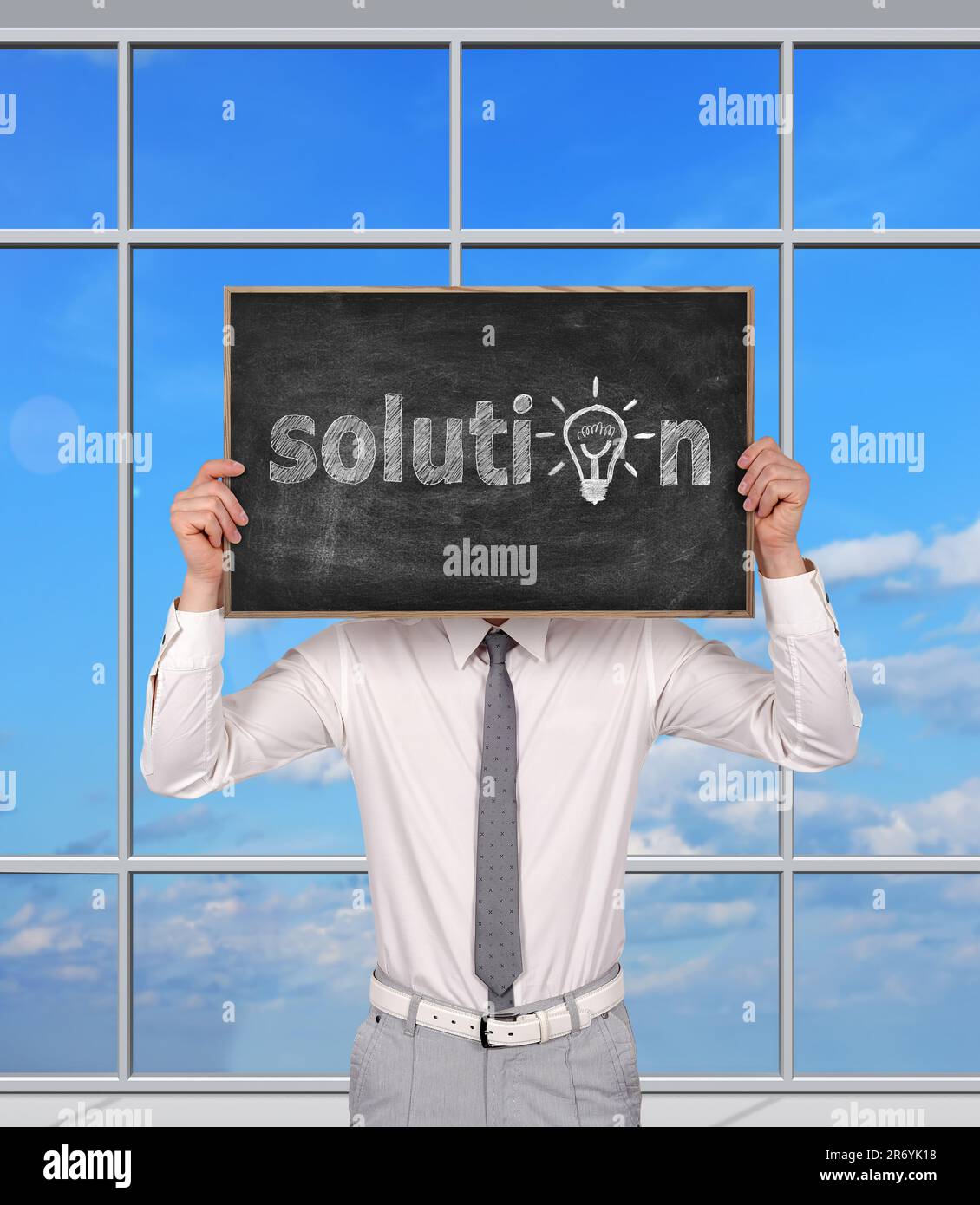 businessman holding board with drawing solution symbol Stock Photo - Alamy