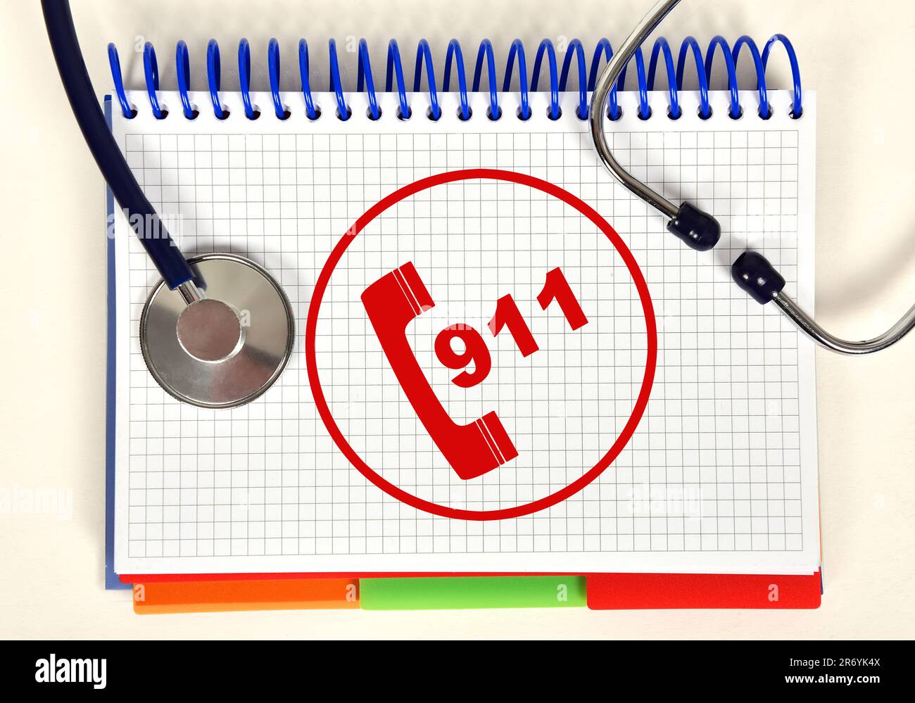 open book with 911 symbol and stethoscope on desk Stock Photo - Alamy