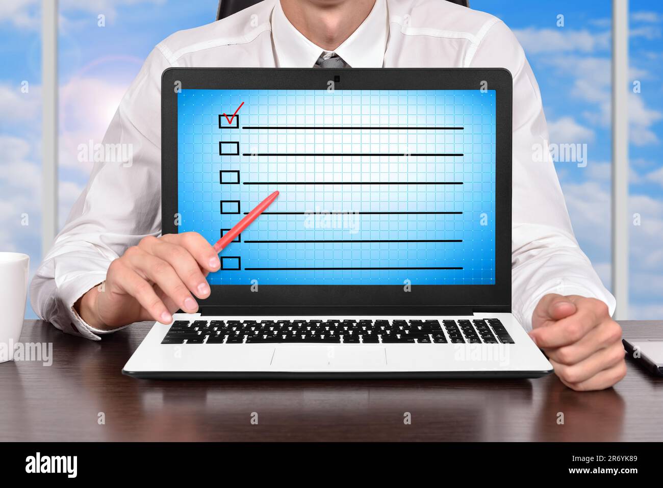 Businessman pointing to screen with application form on screen Stock ...