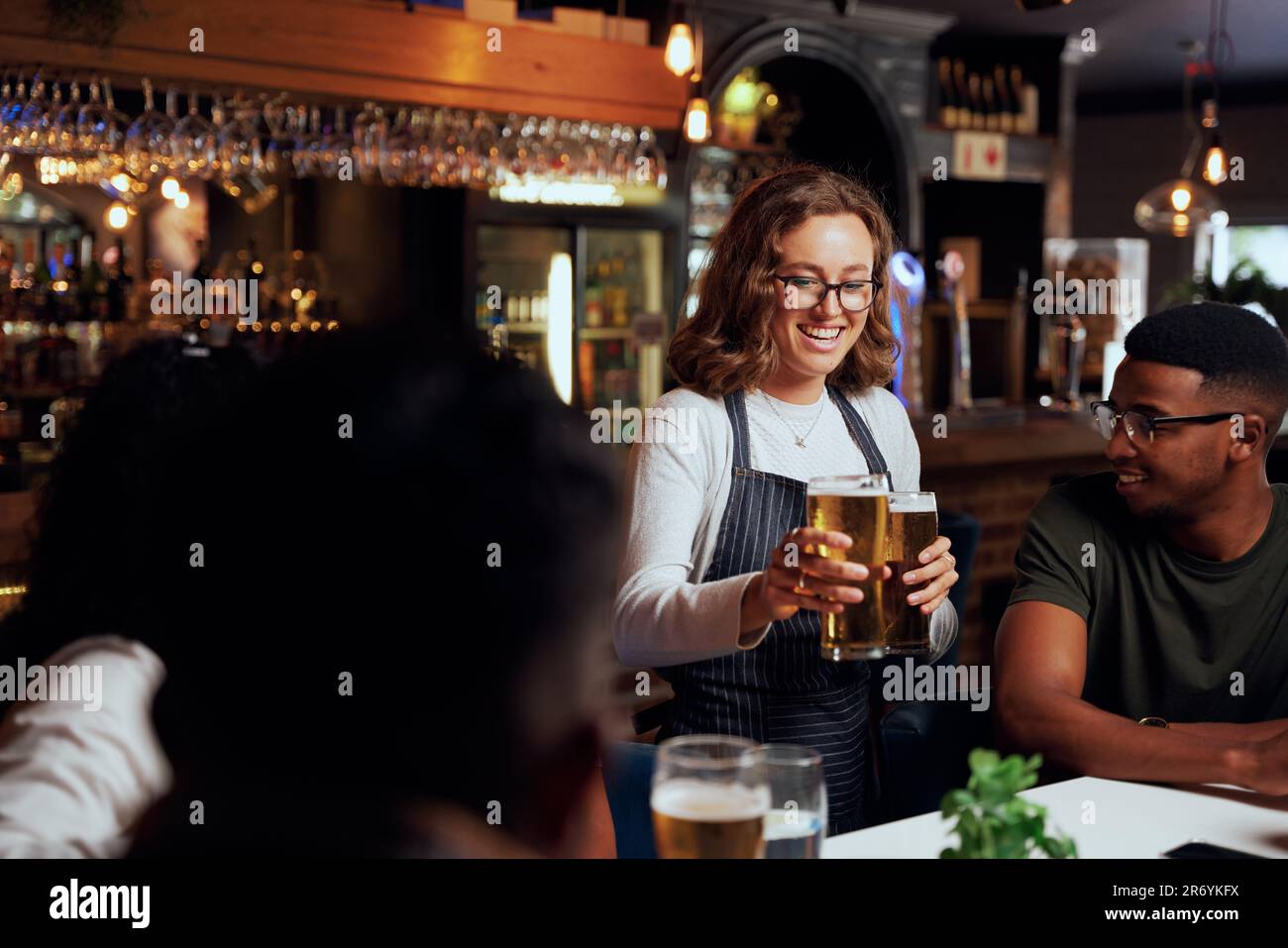 Happy young multiracial group of friends in casual clothing receiving ...