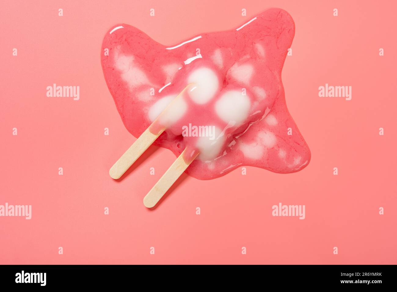 top view half melted butterfly shape popsicle on pink background Stock ...