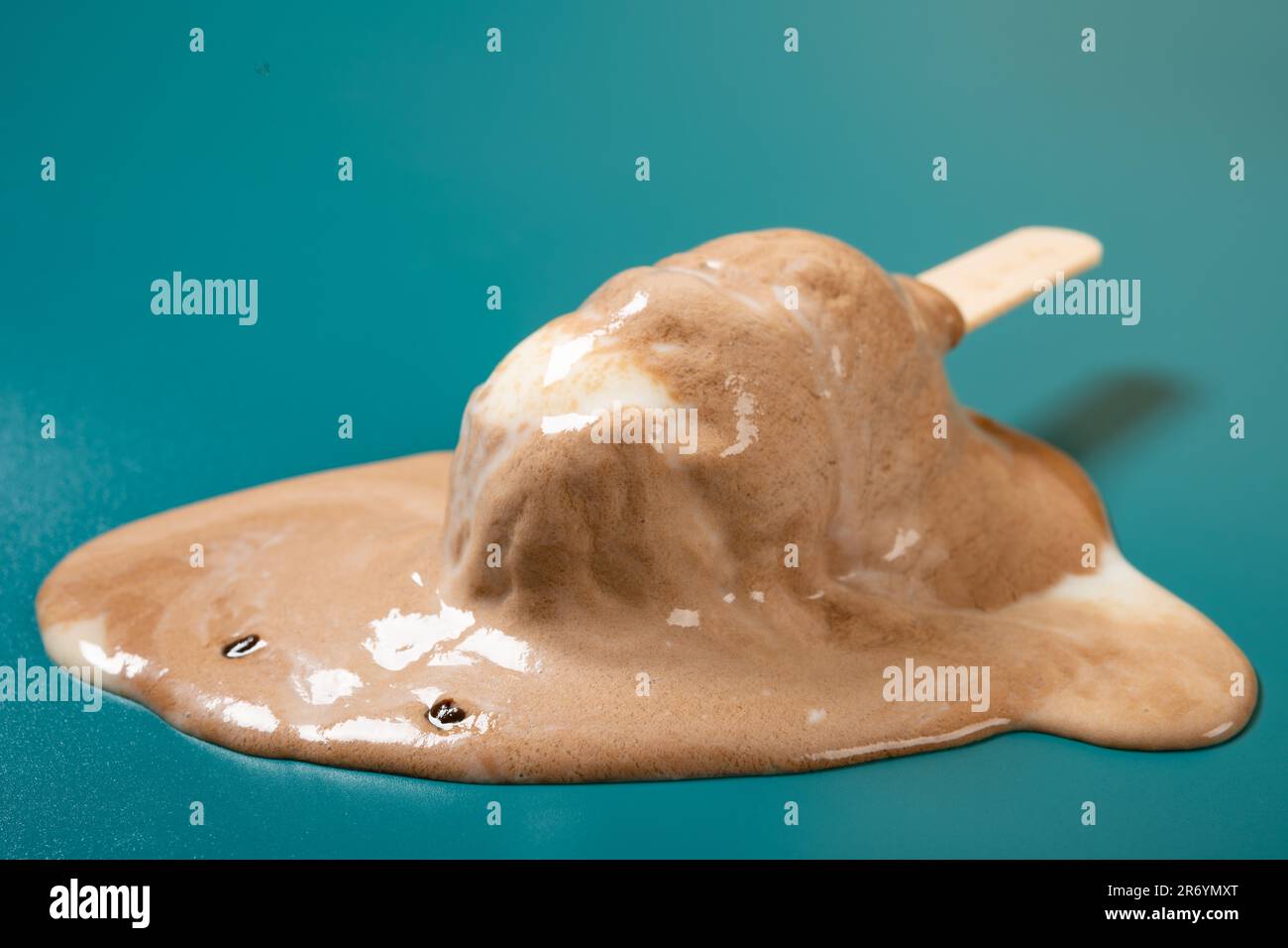 half melted cute tiger shape popsicle on dark green background Stock ...