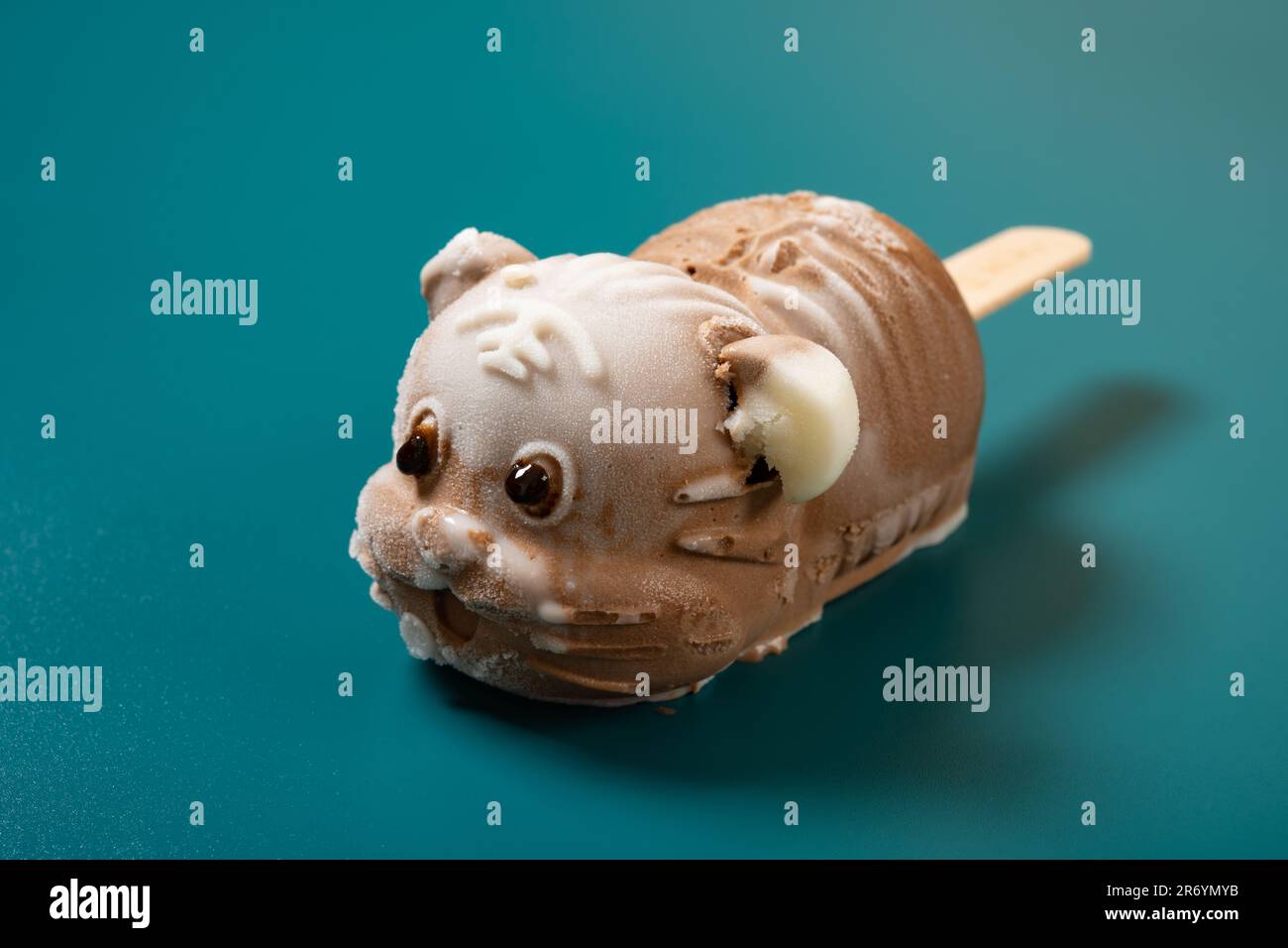 cute tiger shape popsicle on dark green background Stock Photo - Alamy