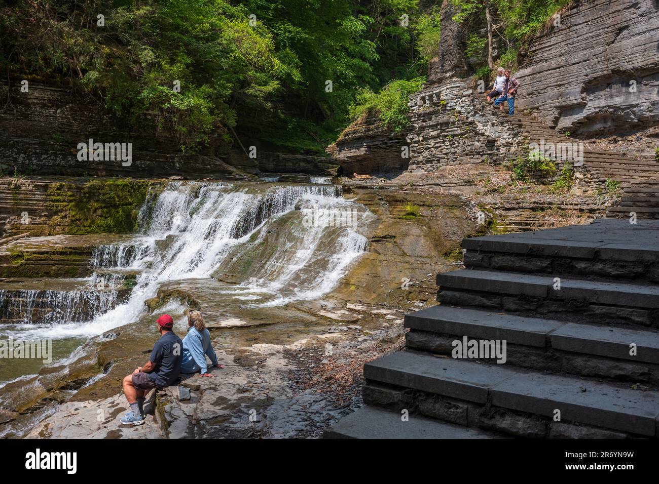 Ithaca, NY, USA - Jun 11, 2023: A couple observes the rapids of Lucifer ...