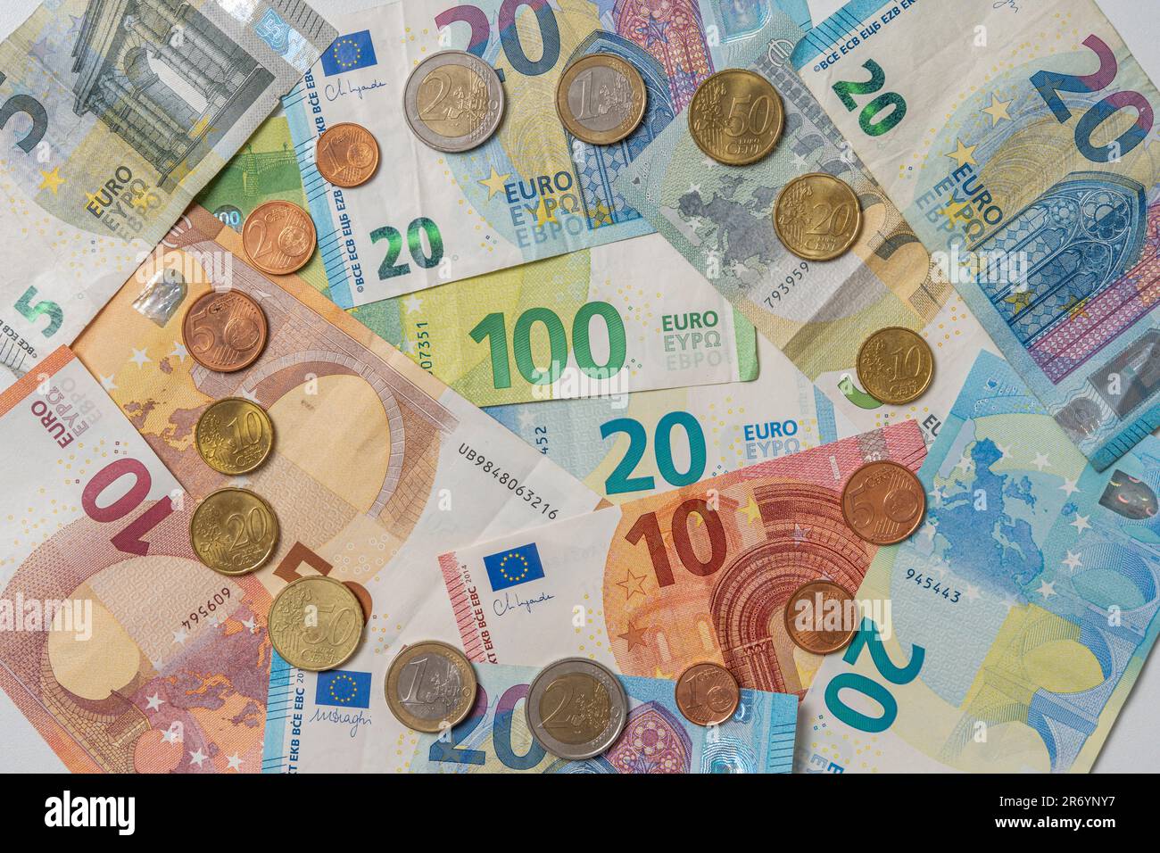 Still life. Close-up view of euro banknote and coins Stock Photo - Alamy