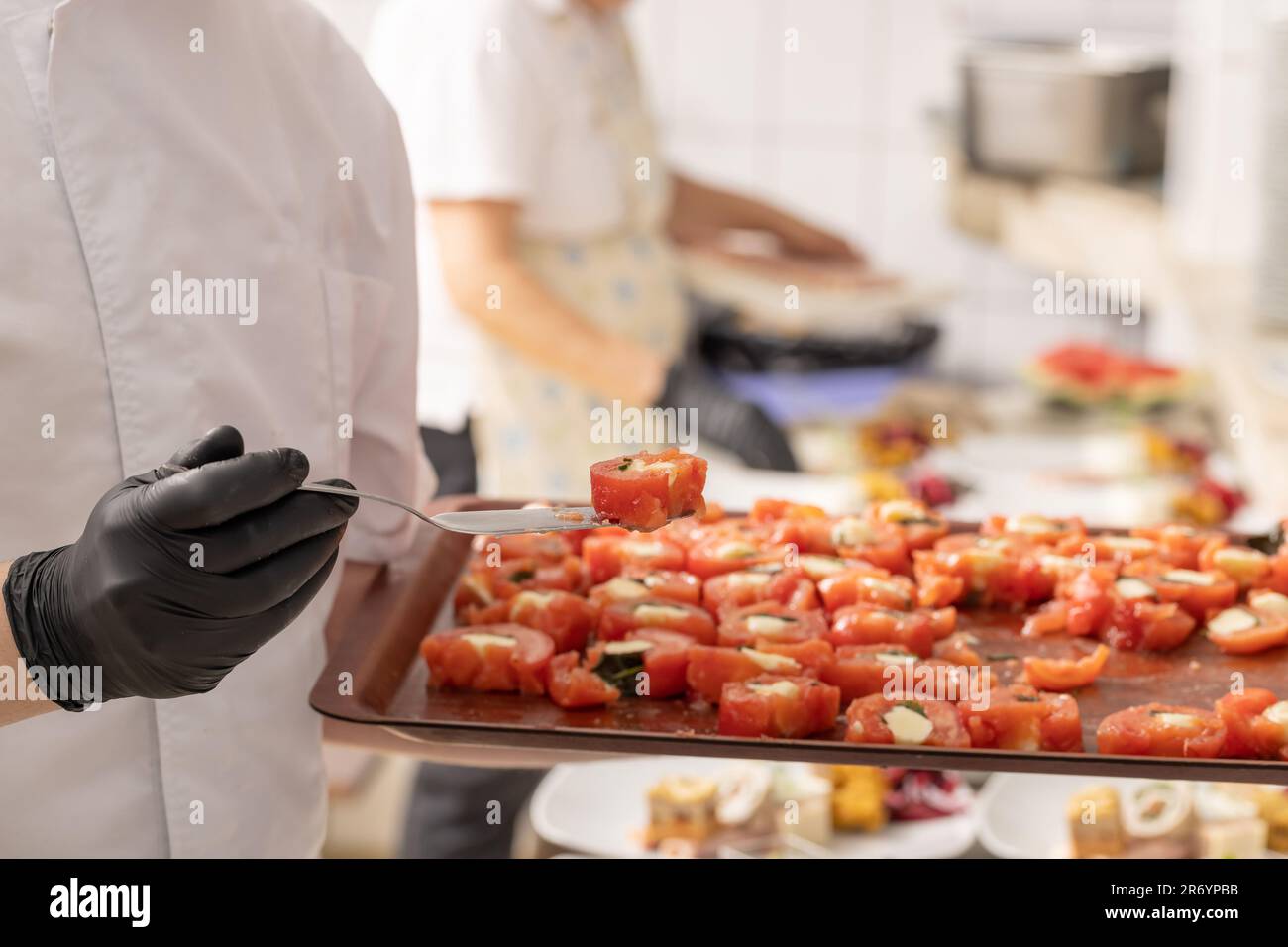 Chef is create appetizer dish on commercial kitchen Stock Photo - Alamy
