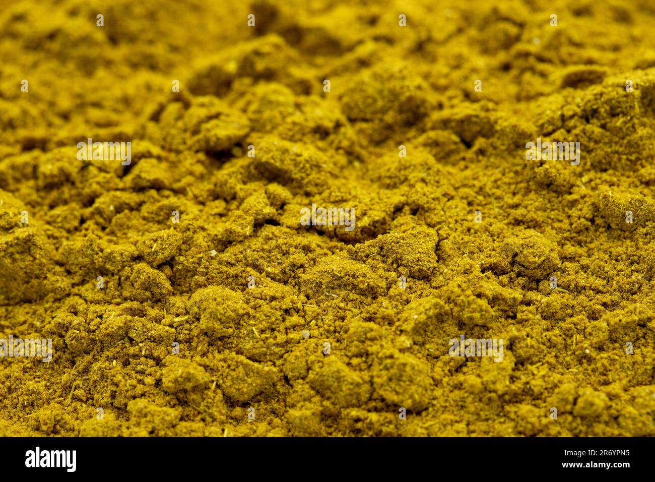 Pile of curry powder as background, spice or seasoning as background ...