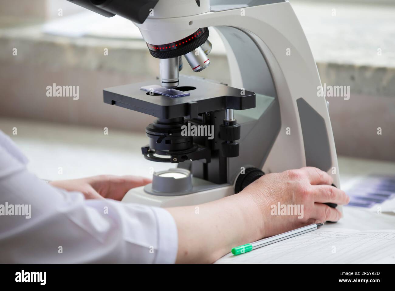 Scientist hands microscope close up hi-res stock photography and images ...