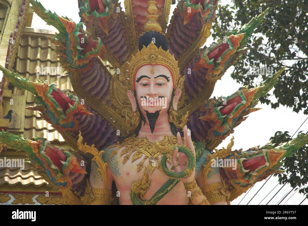 Statue of a standing angel with a serpent covering the back, guarding ...