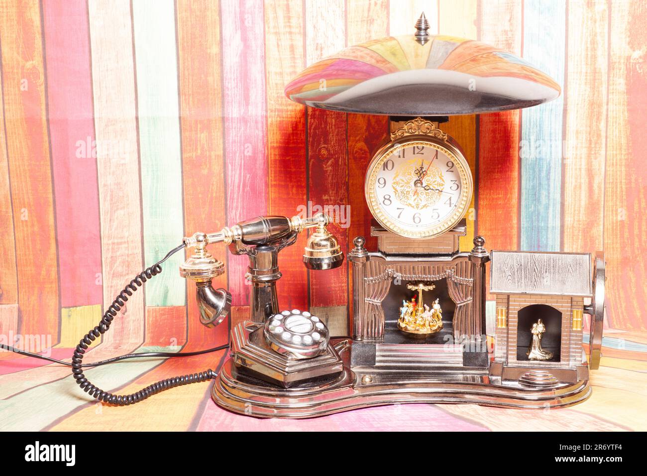 Vintage telephone, antique clock with lamp Stock Photo - Alamy