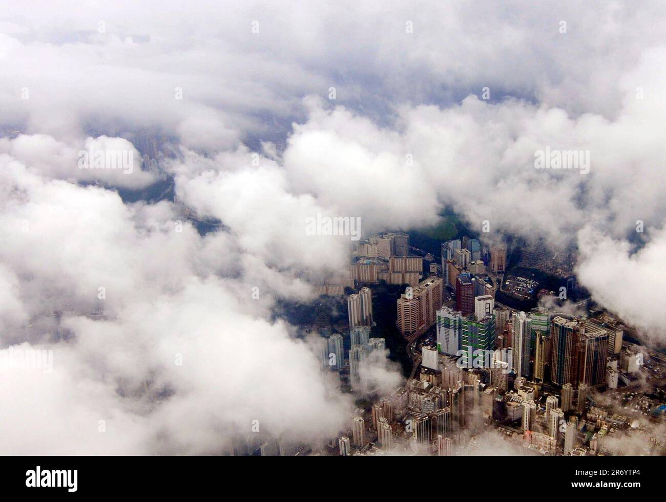 Aerial view of high rise buildings between the clouds in Hong Kong ...