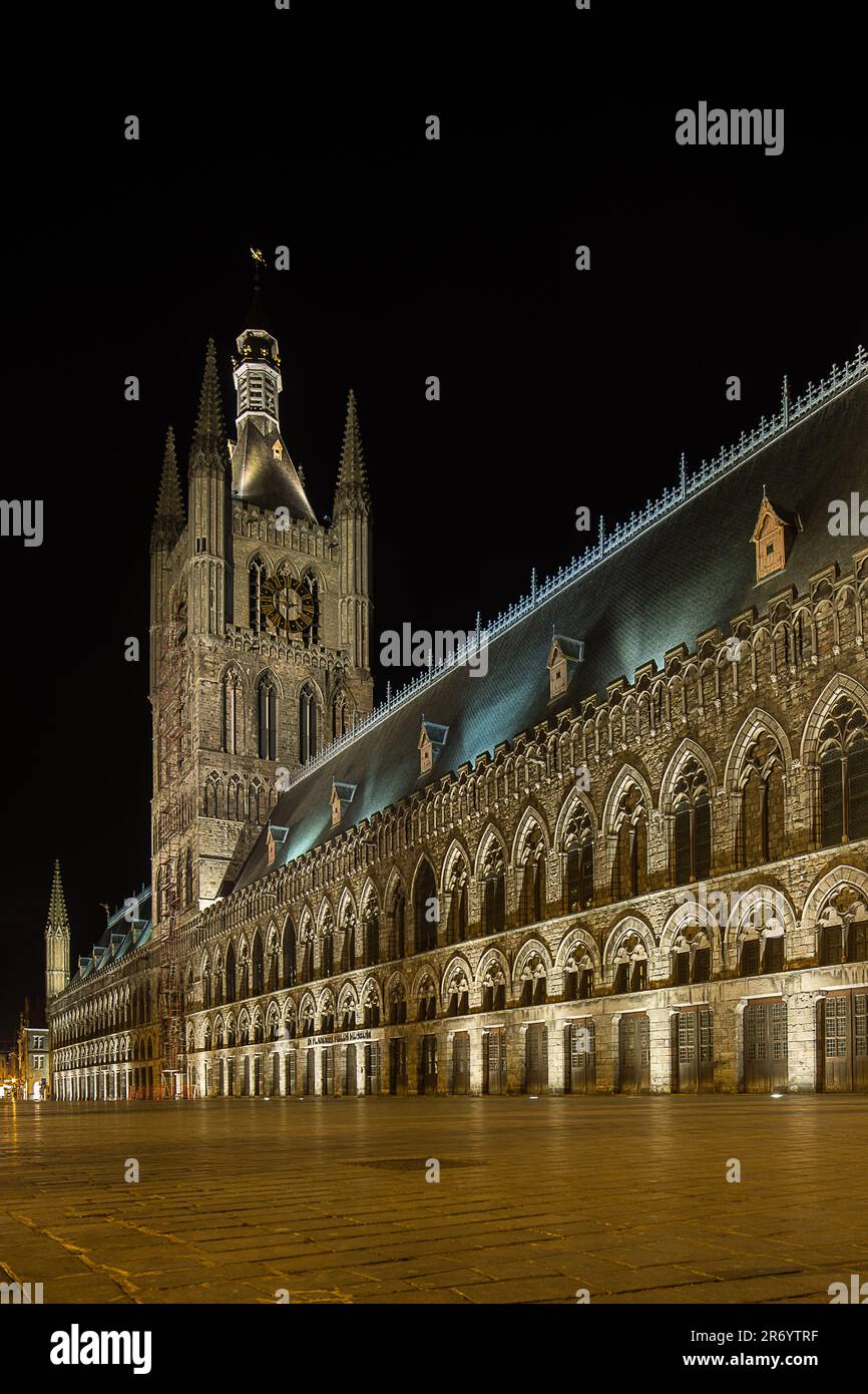 A vertical shot of the In Flanders Fields Museum at night in Ypres ...