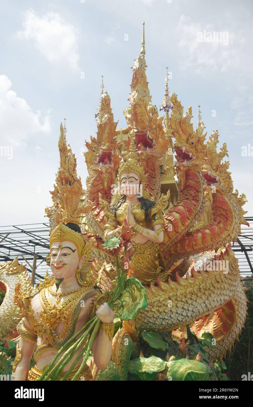 Statue of a standing angel with a serpent covering the back, guarding ...