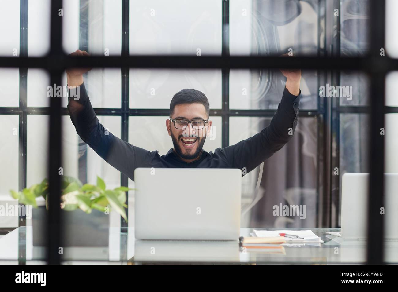 Business man sitting at his desk in the office Stock Photo - Alamy