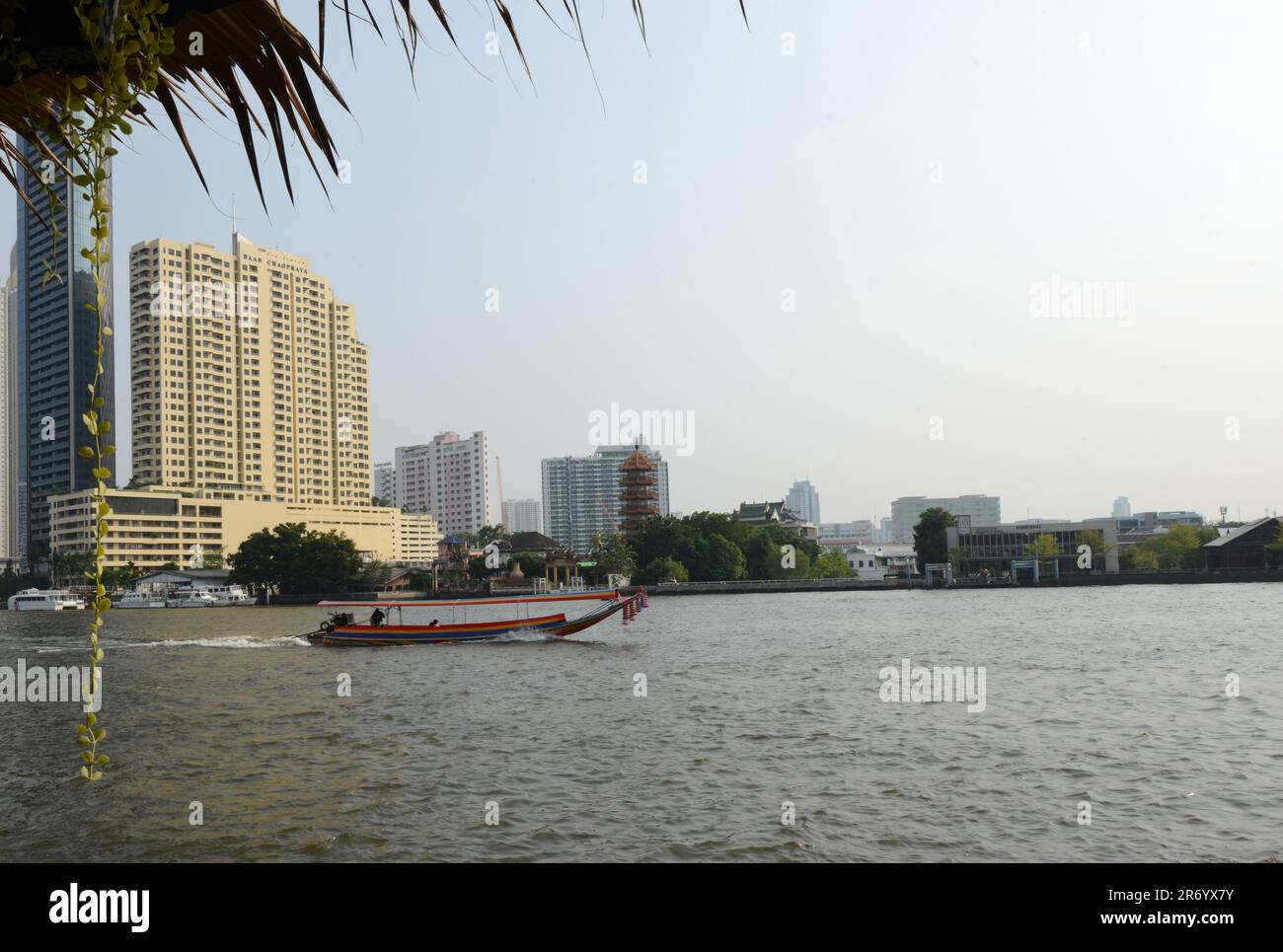 Baan Chaopraya building and the Chee Chin Khor pagoda. Bangkok ...