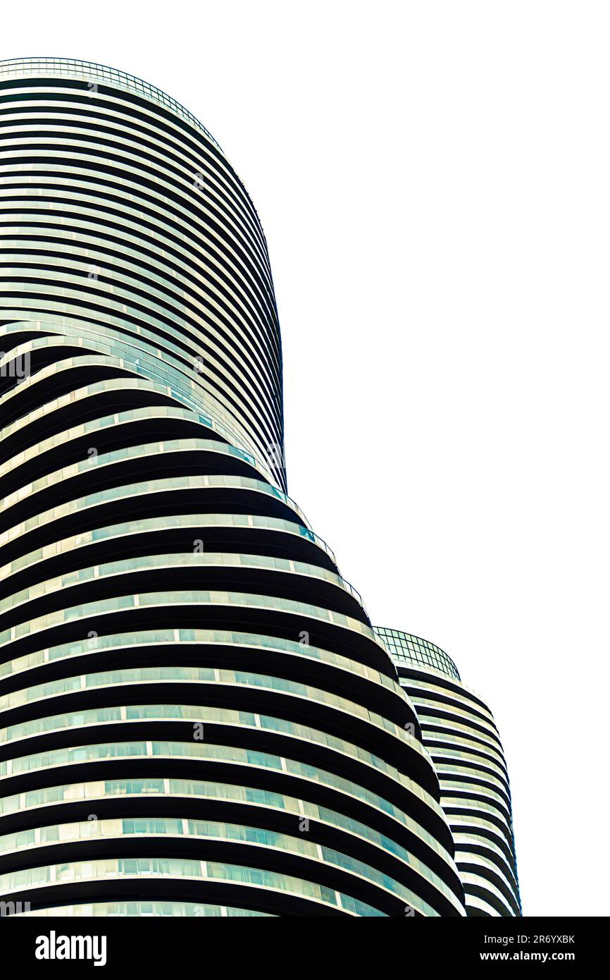 A modern cityscape featuring a tall building with curved edifices ...