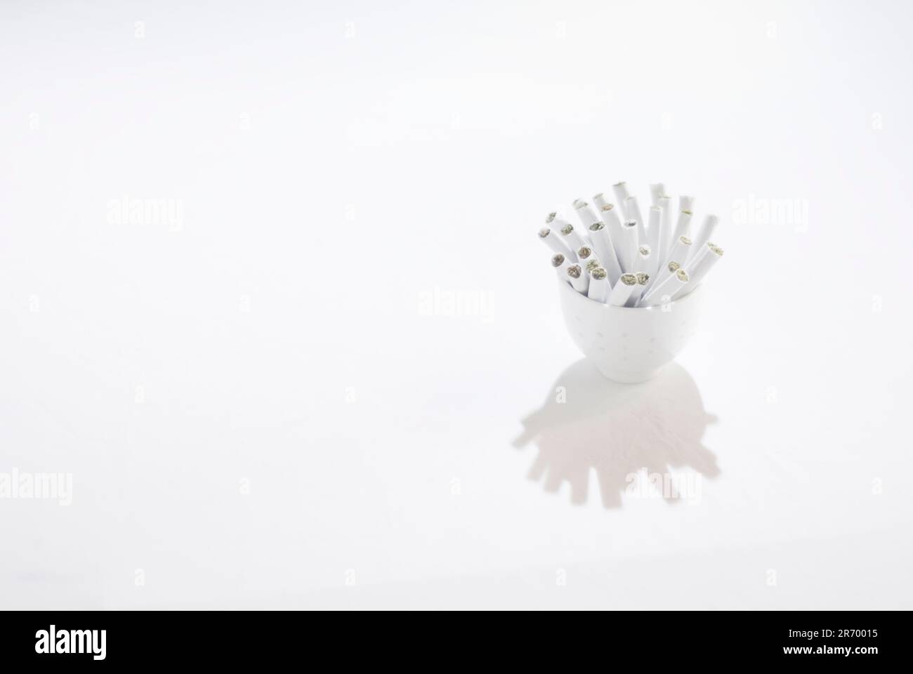 A cup of joints rolled with medical grade marijuana on display at MMJ ...