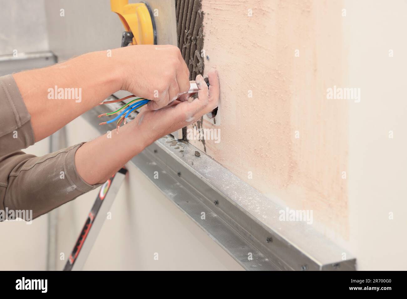 Worker installing socket in tile indoors, closeup Stock Photo - Alamy
