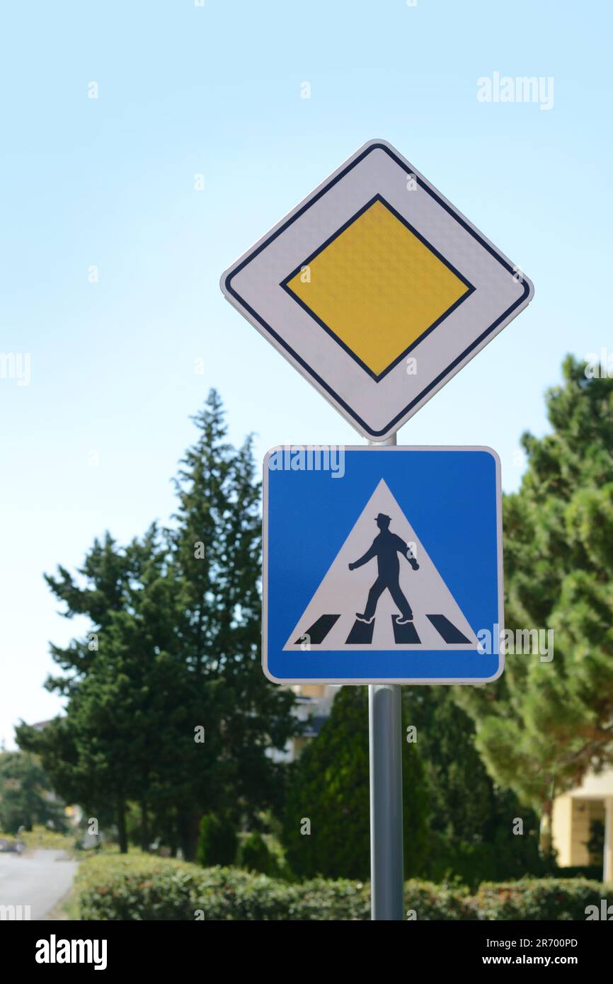 Pedestrian Crossing and Priority road signs outdoors Stock Photo - Alamy
