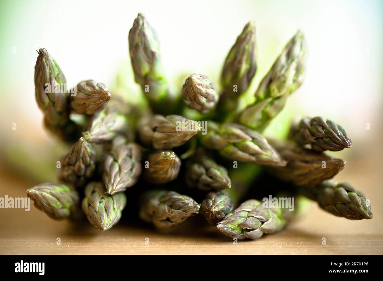 Homegrown organic asparagus sits atop a wood counter top in a Seattle ...