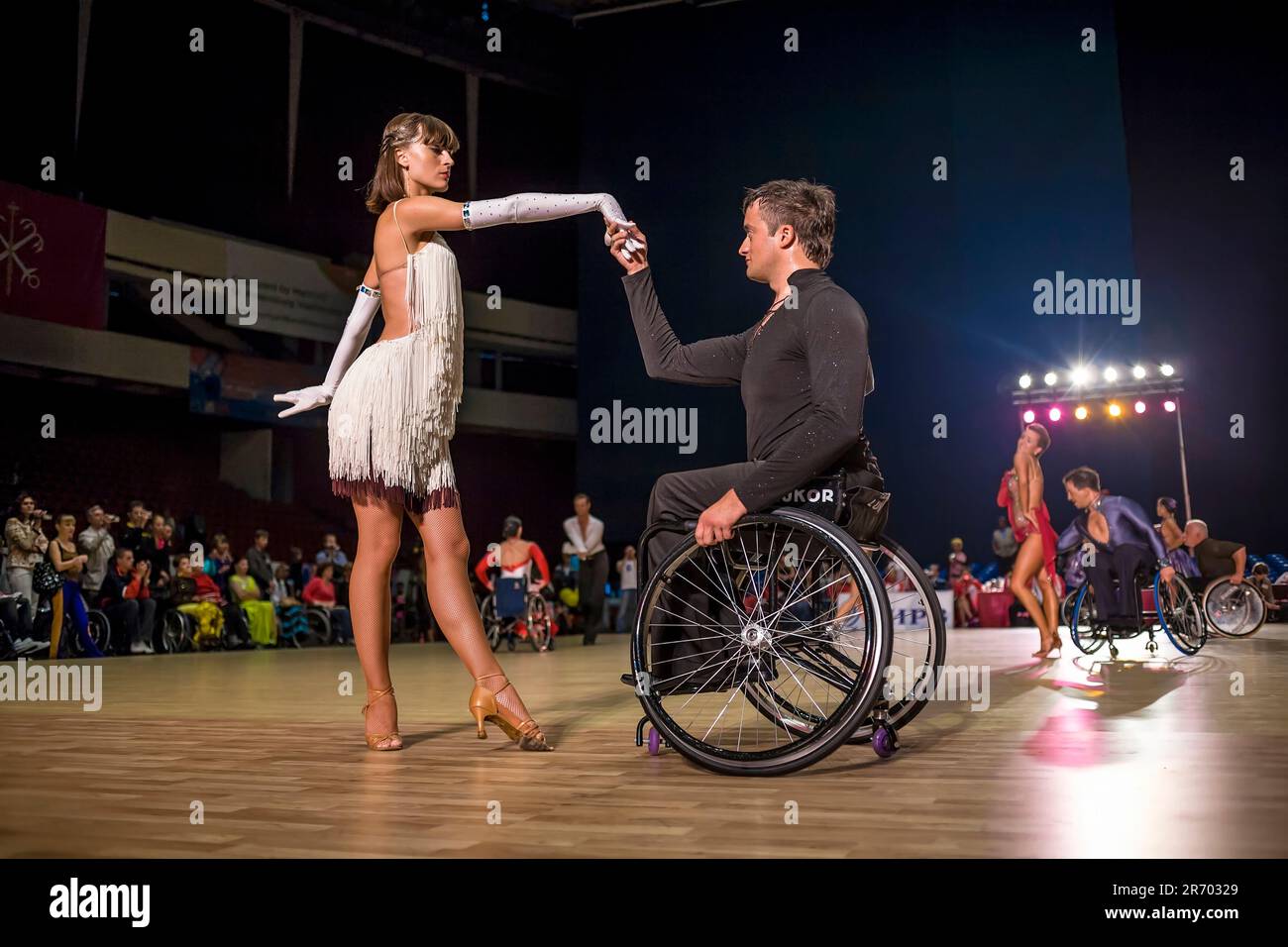 Man In Wheelchair Performing Dance With His Partner During A ...