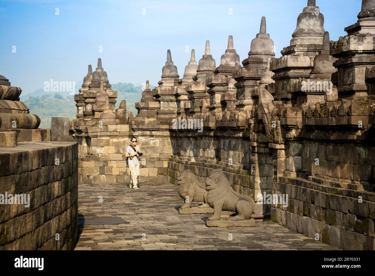 Tourist Exploring Borobudur Temple In Yogyakarta, Java Island ...
